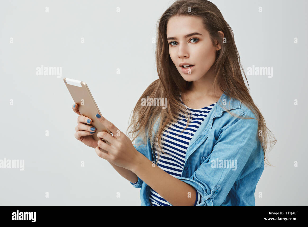 Studio shot attractive modern millennial young fashionable sassy woman ...