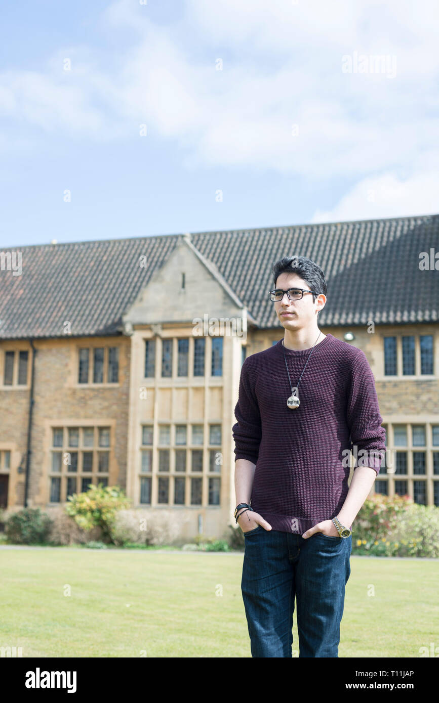 A confident male Middle Eastern international student in the square of ...