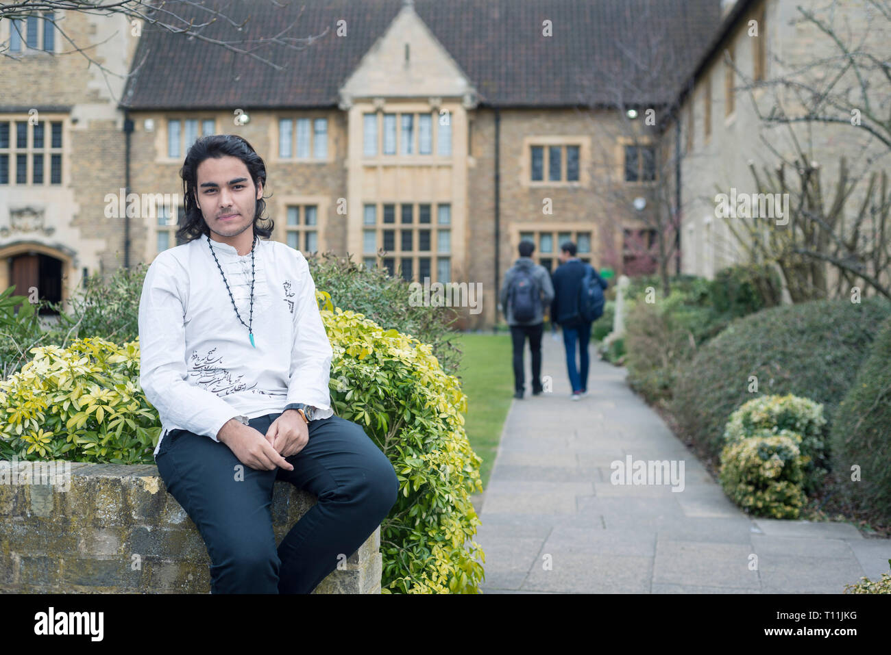 A confident male Middle Eastern international student in the square of ...