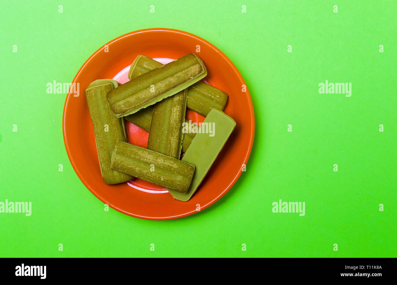 Matcha green tea flavored biscuits on colorful background Stock Photo ...