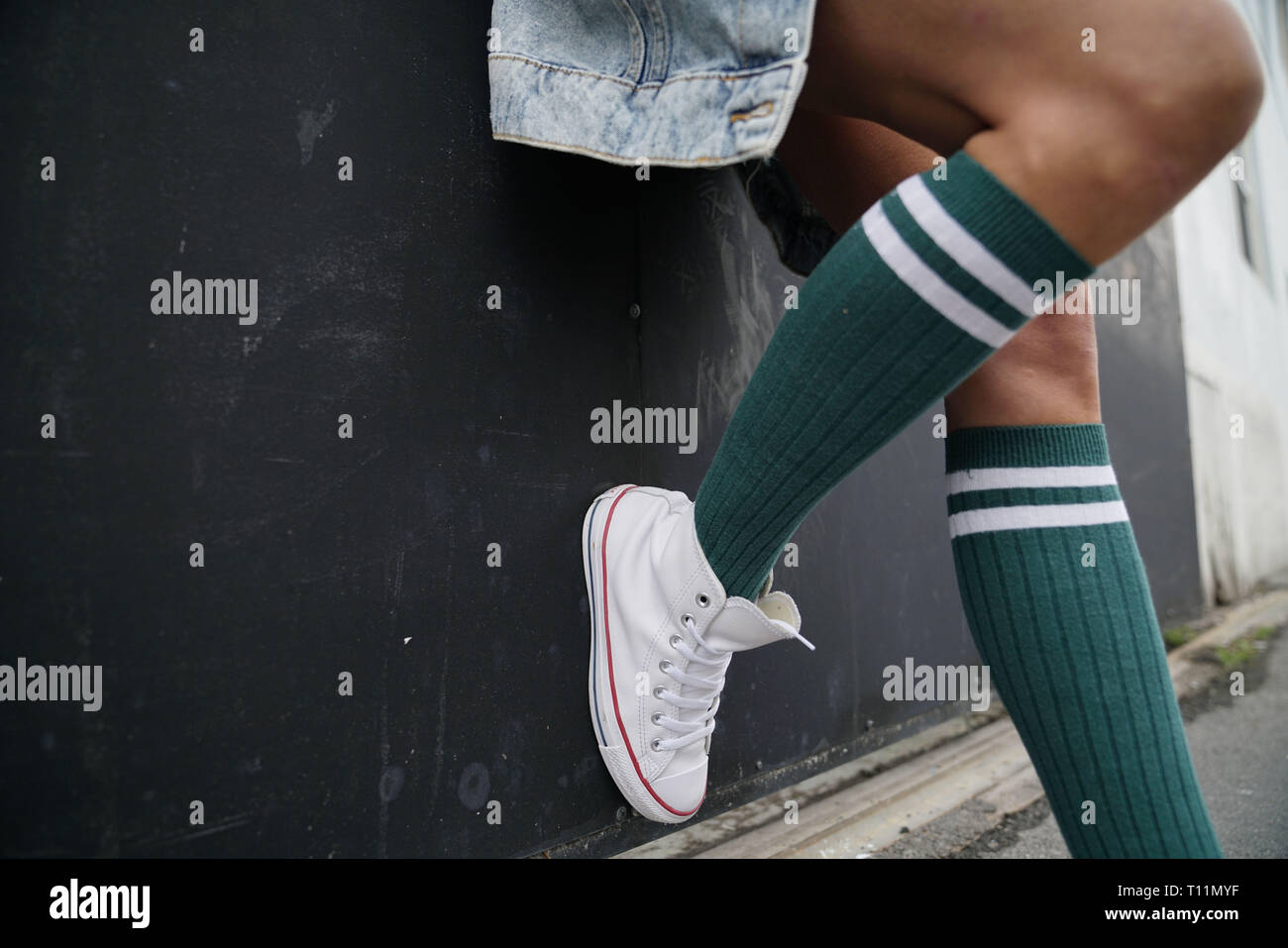 Close up of woman's legs wearing knee socks in urban setting Stock ...