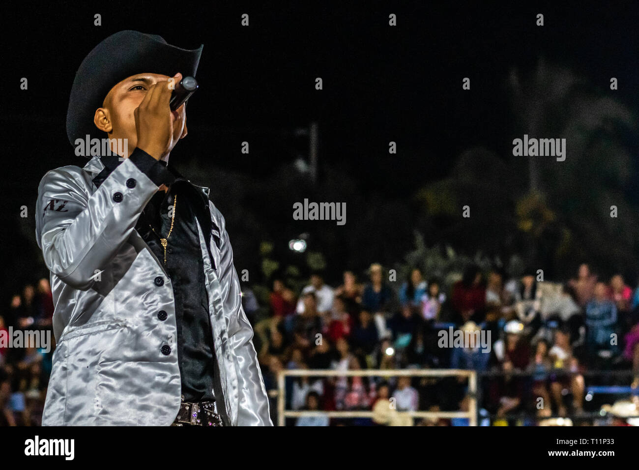 latin man singing in Guatemalan rodeo Stock Photo - Alamy