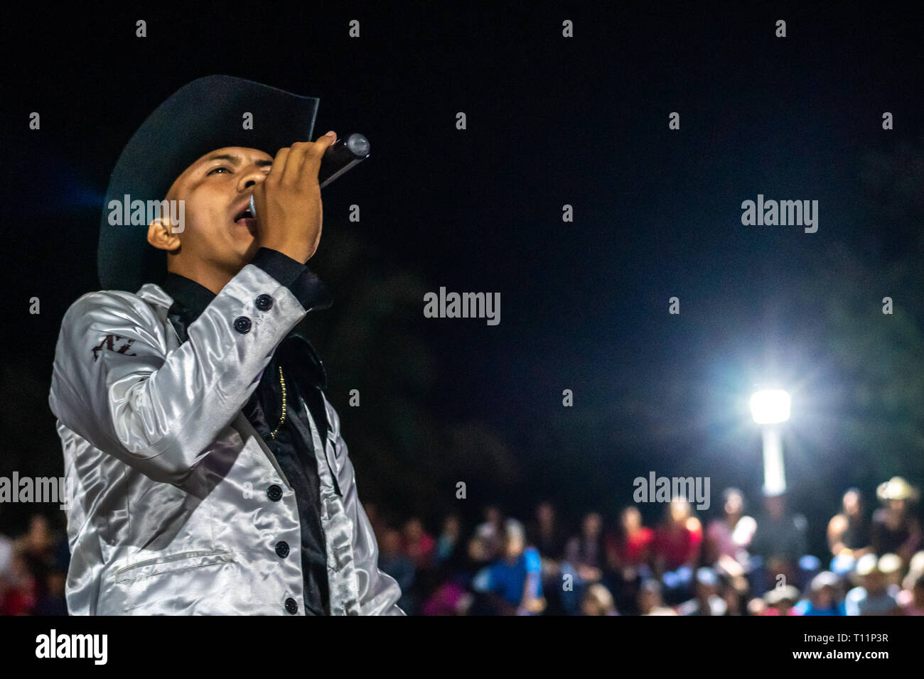 latin man singing in Guatemalan rodeo Stock Photo - Alamy