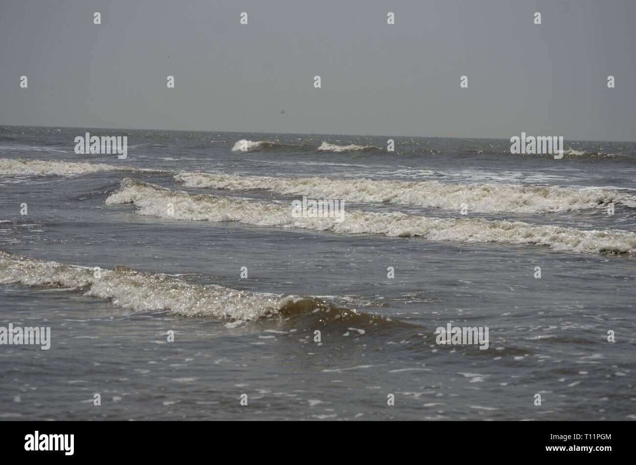 Clean water waves on beach Stock Photo - Alamy