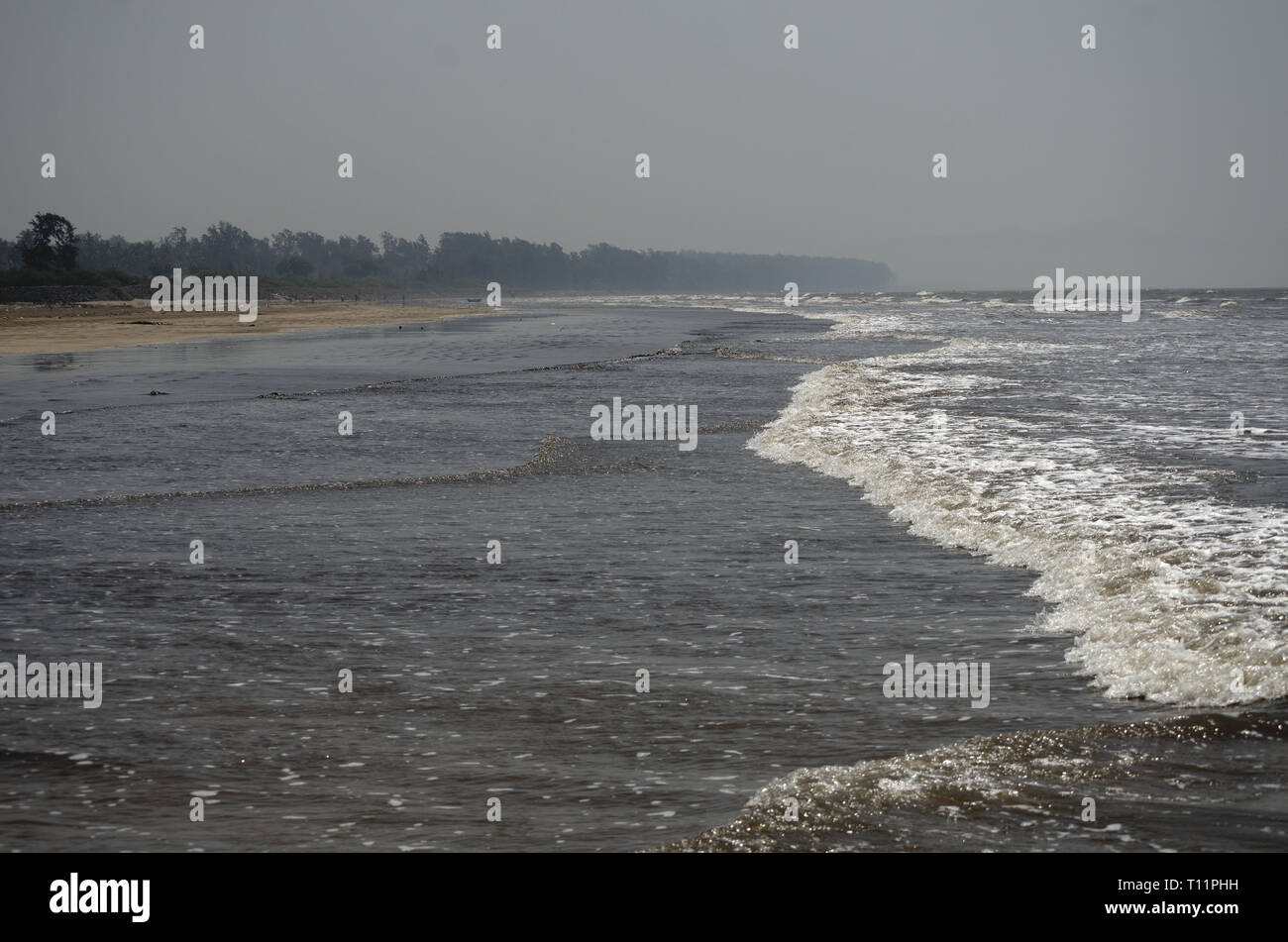 Clean water waves on beach Stock Photo - Alamy