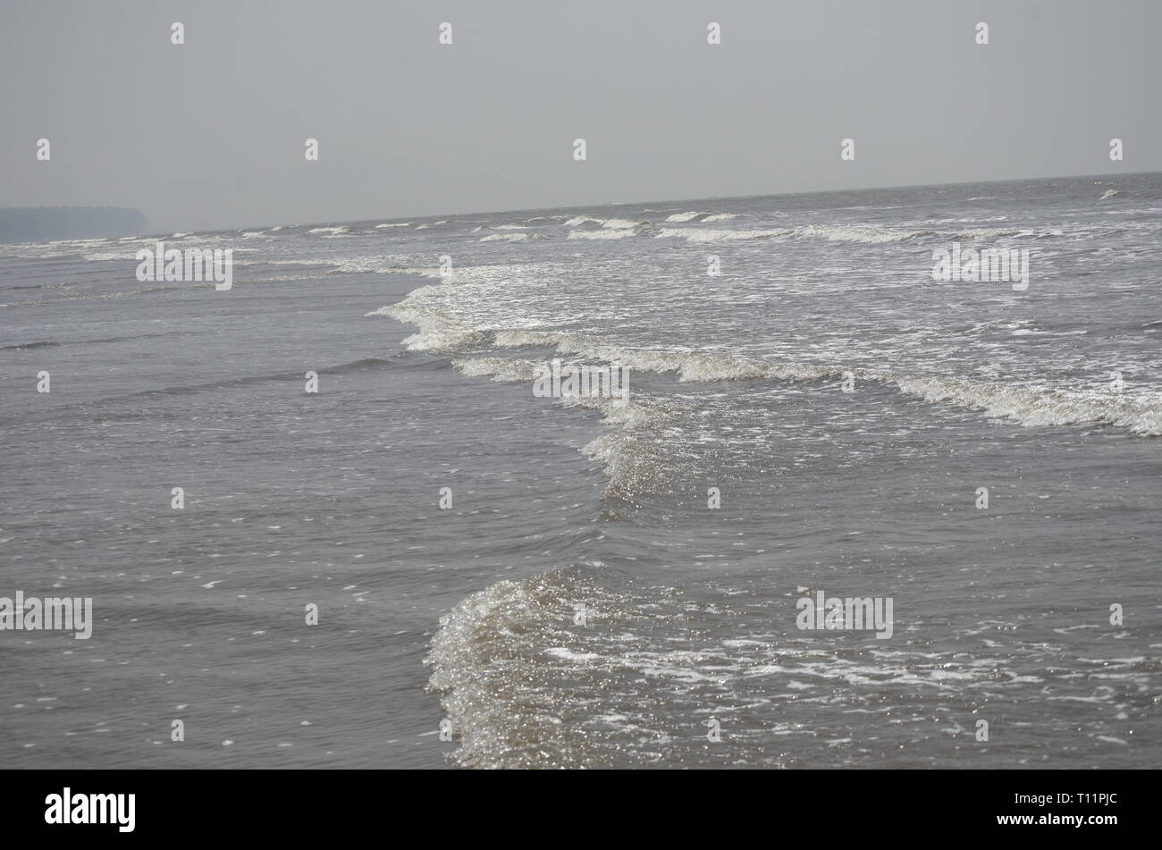 Clean water waves on beach Stock Photo - Alamy