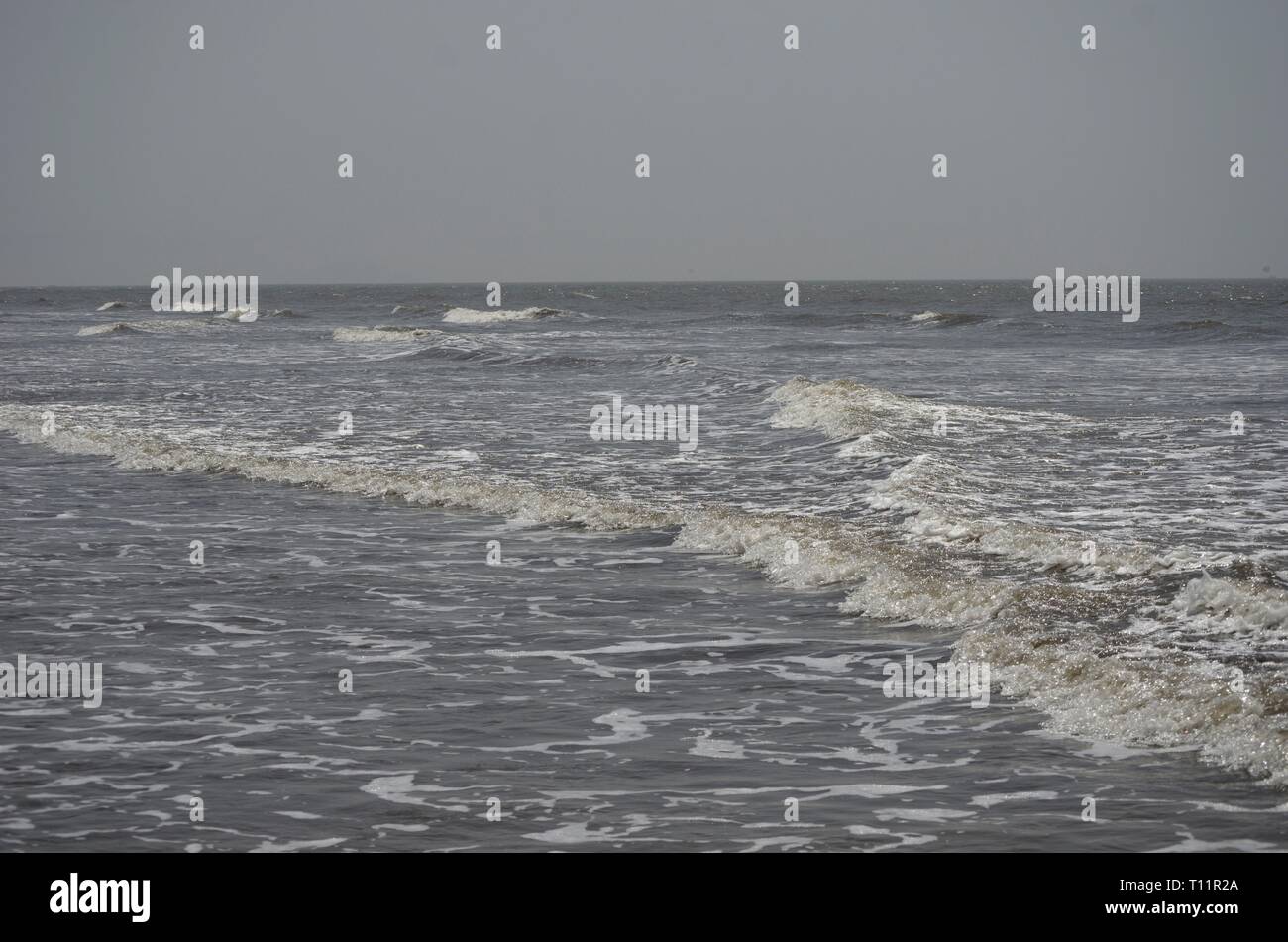 Clean water waves on beach Stock Photo - Alamy
