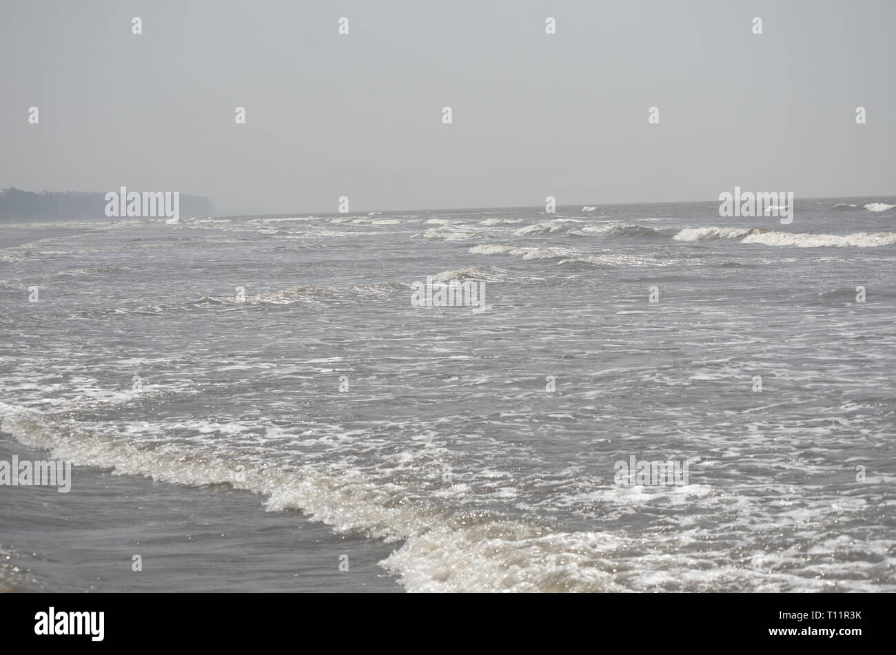 Clean water waves on beach Stock Photo - Alamy