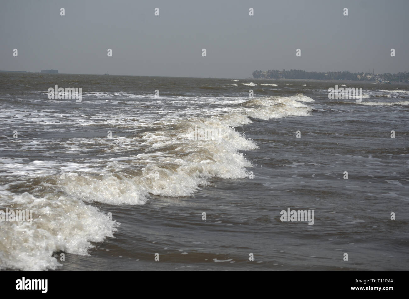 Clean water waves on beach Stock Photo - Alamy