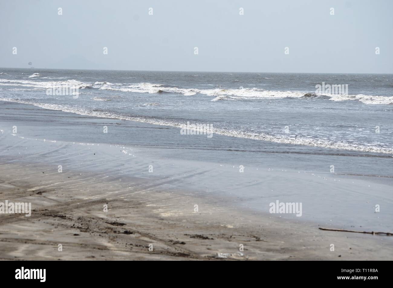 Clean water waves on beach Stock Photo - Alamy