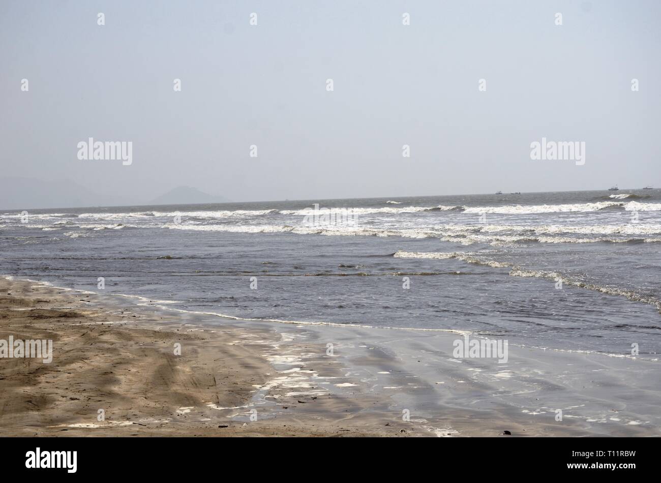 Clean water waves on beach Stock Photo - Alamy