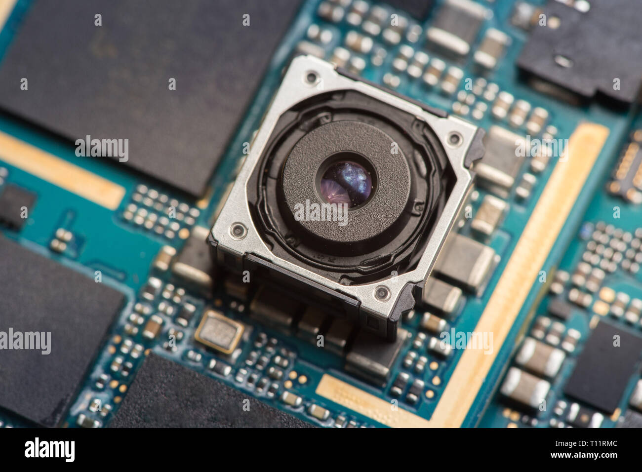 Mobile phone camera module on a blue printed circuit board Stock Photo ...