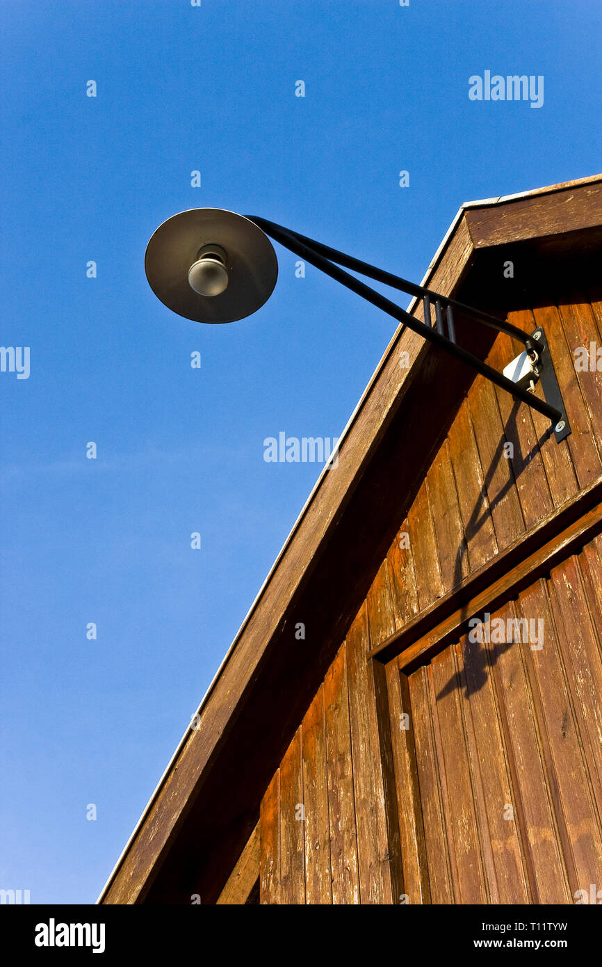 An old lamp on an old wooden barn Stock Photo - Alamy