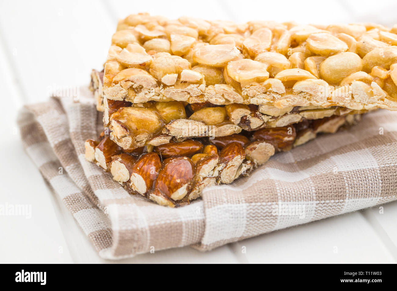 Sweet nut bars with honey on checkered napkin Stock Photo - Alamy