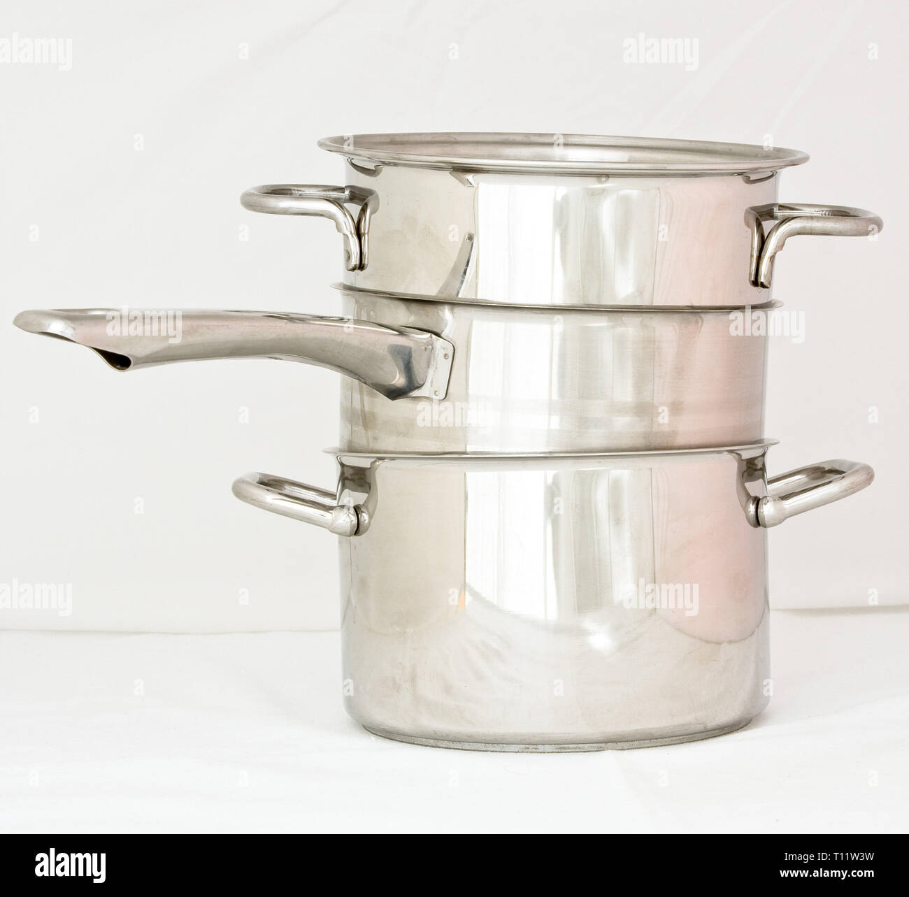 Stacked stainless steel cooking pots Stock Photo - Alamy