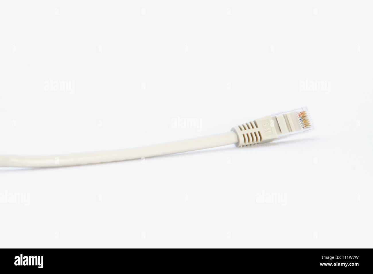 a short gray patchcable in front of a white background Stock Photo - Alamy