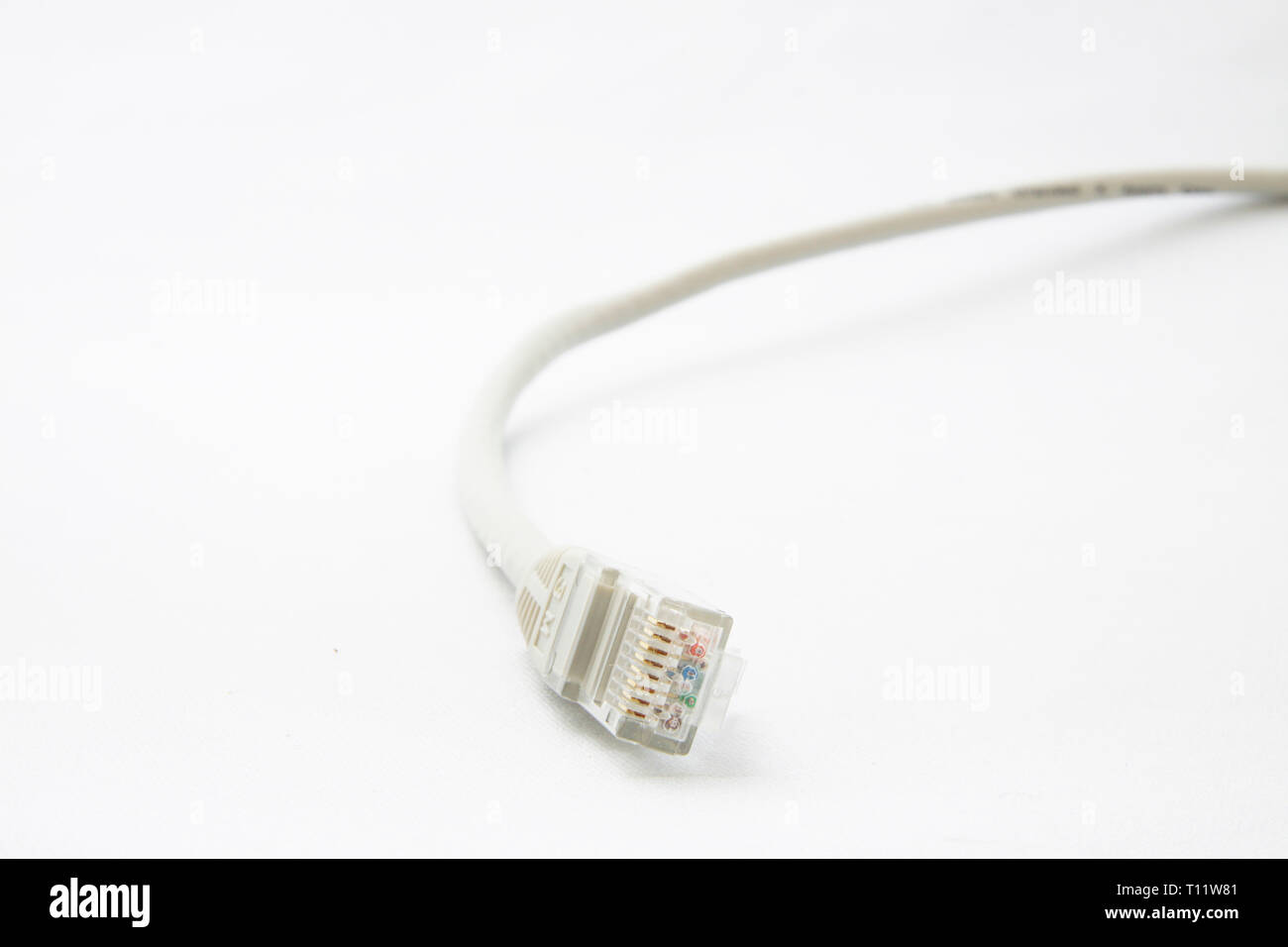 a short gray patchcable in front of a white background Stock Photo - Alamy