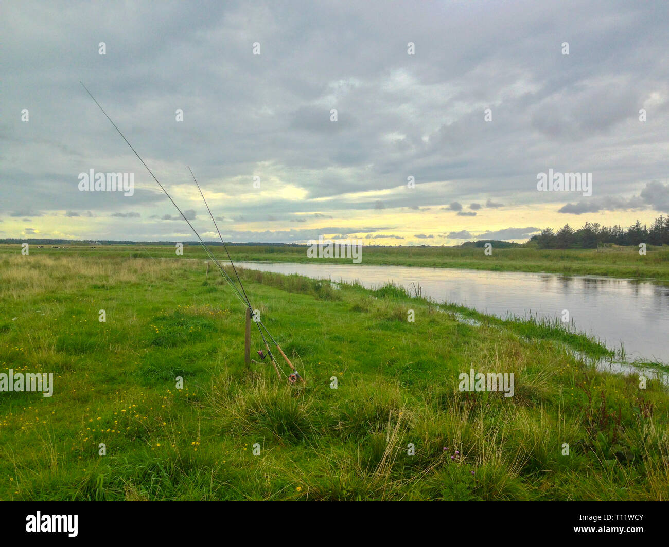 sundowner in denmark at the ringkobing fjord with two flyfishing rods ...