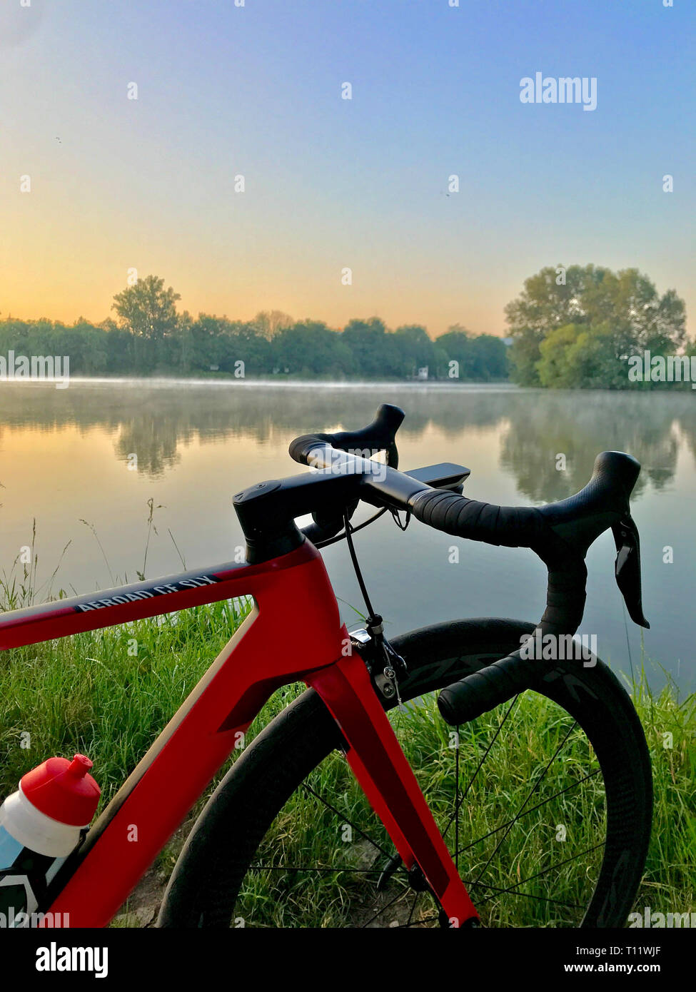 red road bike on the bank of neckar at sunrise Stock Photo - Alamy