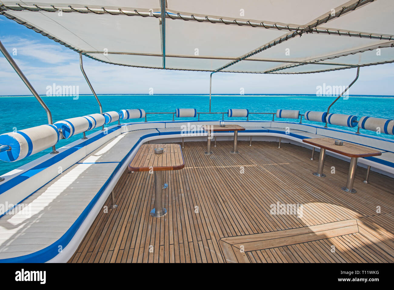Sundeck area of a large luxury motor yacht with chairs sofa table and ...