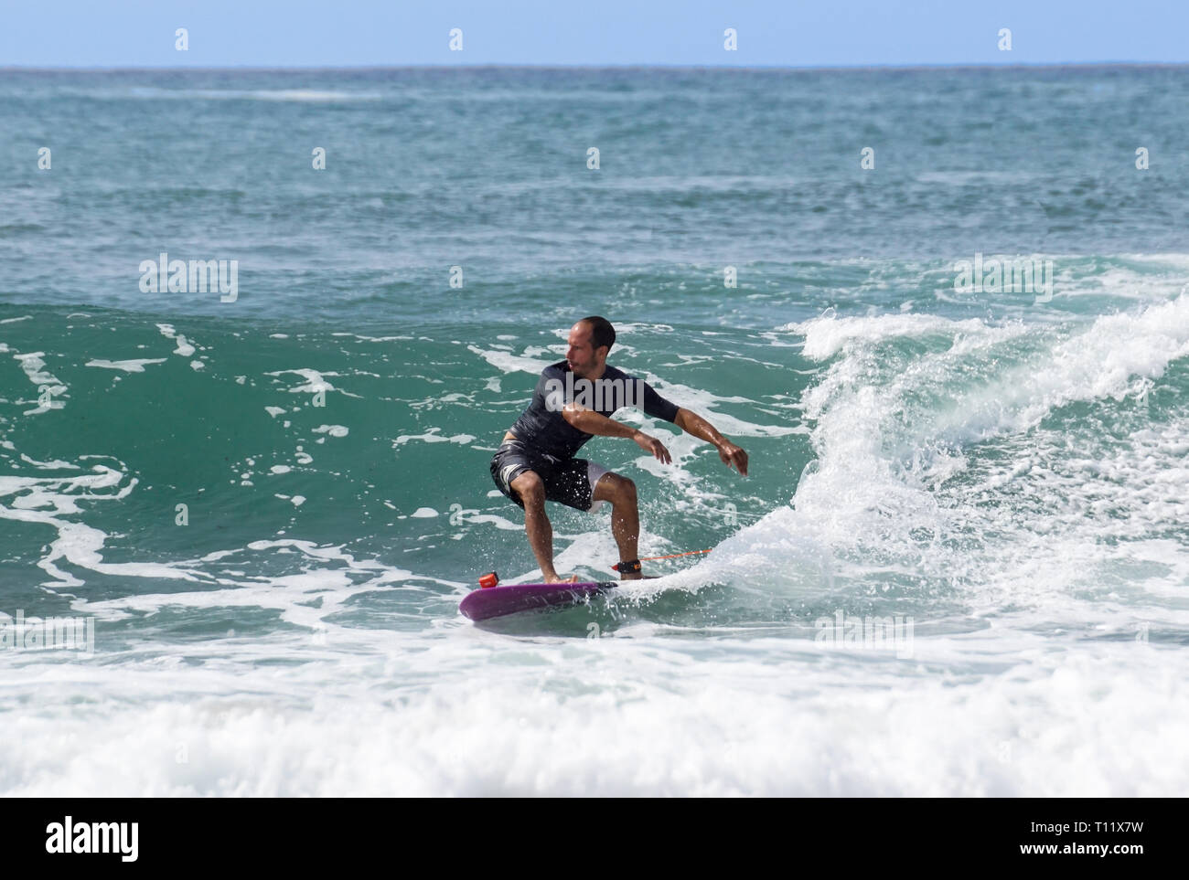 Man in the surf hi-res stock photography and images - Alamy