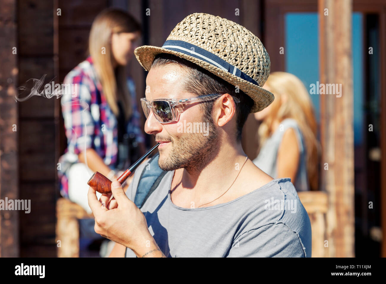 Young woman smoking pipe hi-res stock photography and images - Alamy