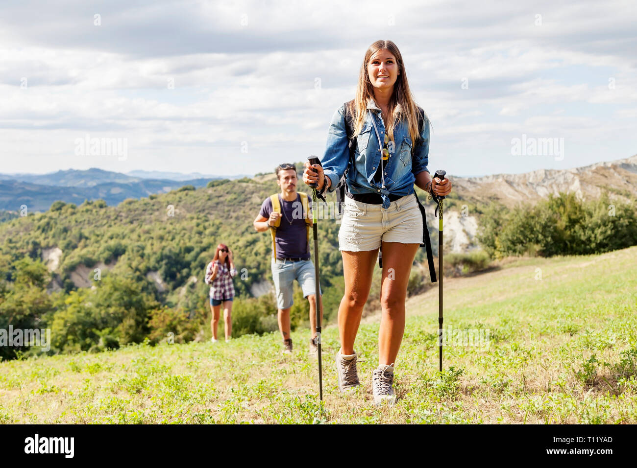 group of hikers in the mountain in single file Stock Photo - Alamy