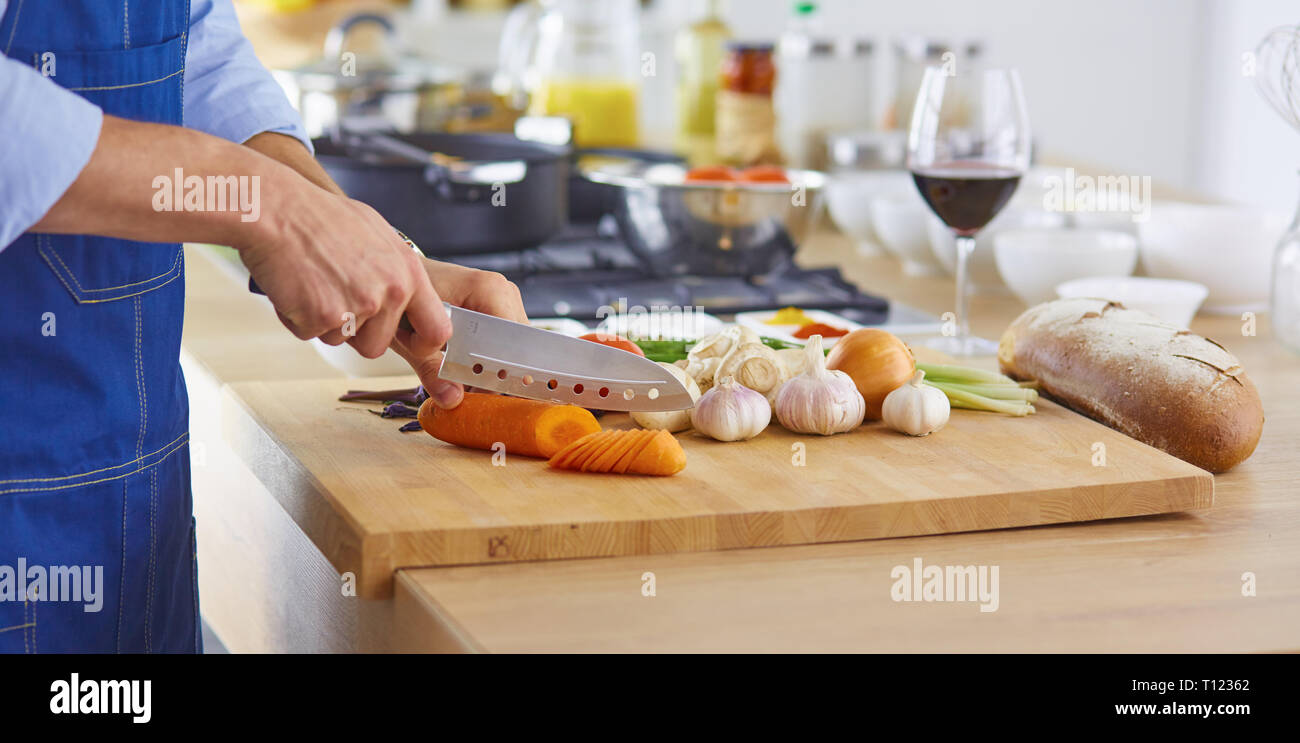 Young man preparing food woman hi-res stock photography and images - Alamy