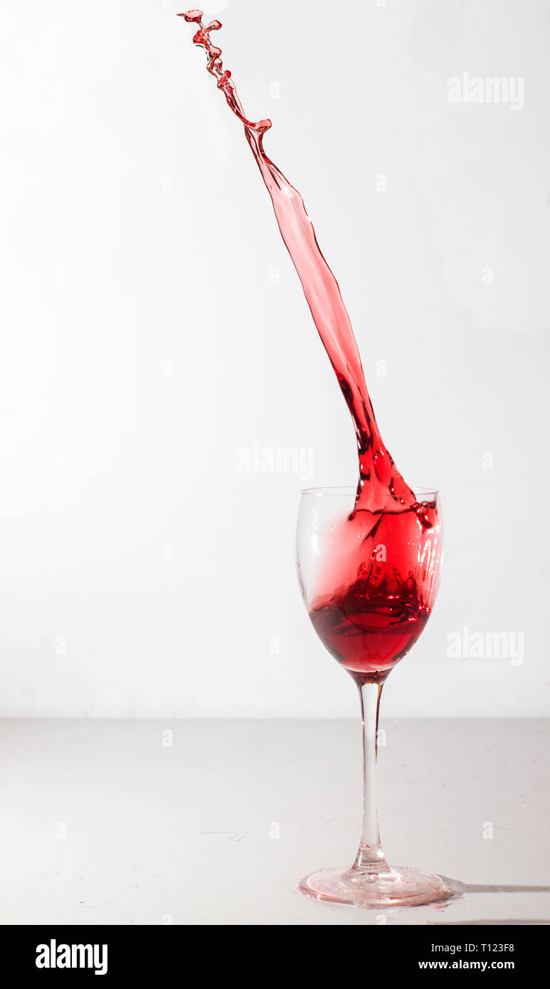 glass of wine with splash Stock Photo - Alamy