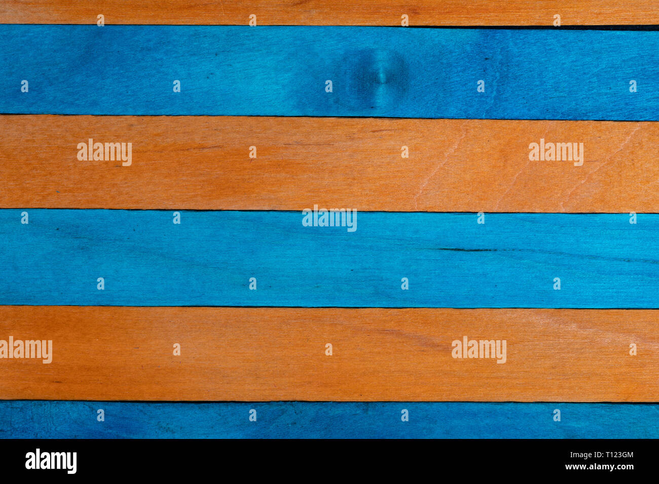 Beautiful texture of natural wood slats of orange and light blue colors ...