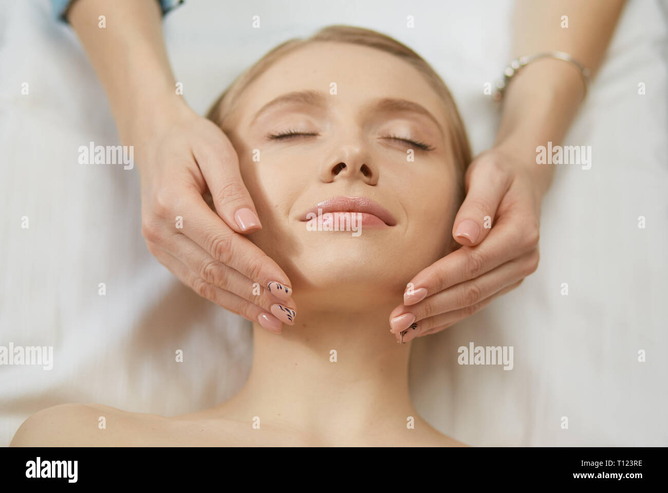 Beautiful young woman in cosmetic salon close up Stock Photo - Alamy