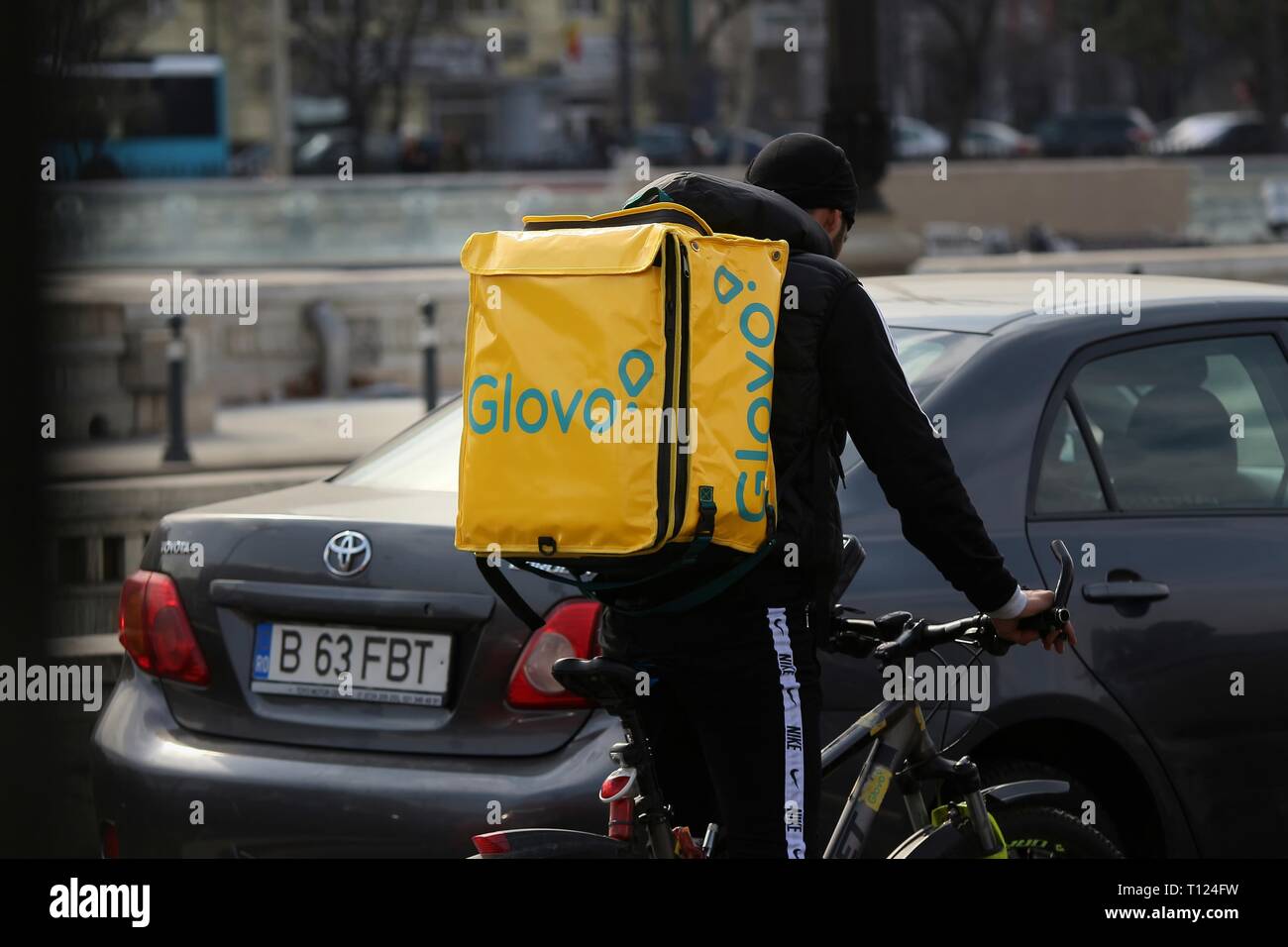 Bucharest, Romania - February 01, 2019: A Glovo food delivery courier ...