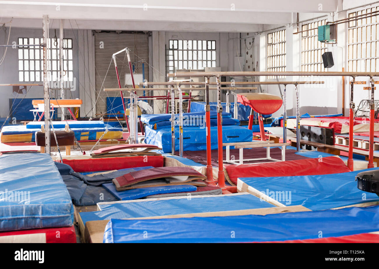 Acrobatic with gymnastic equipment – balance beams, bars and pommel ...