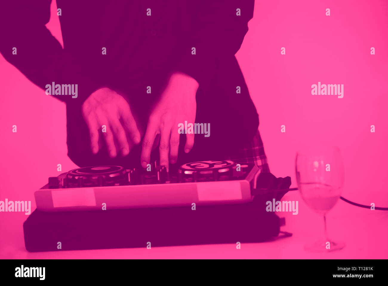 closeup hand Dj or disc jockey in party event pink color tone Stock ...