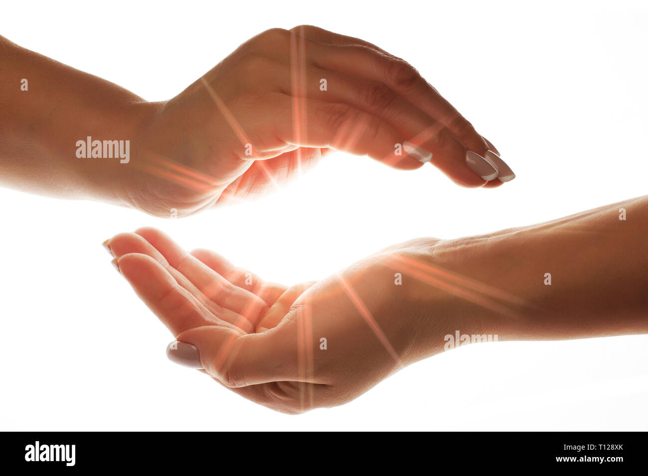 light in the hands isolated on white background Stock Photo - Alamy