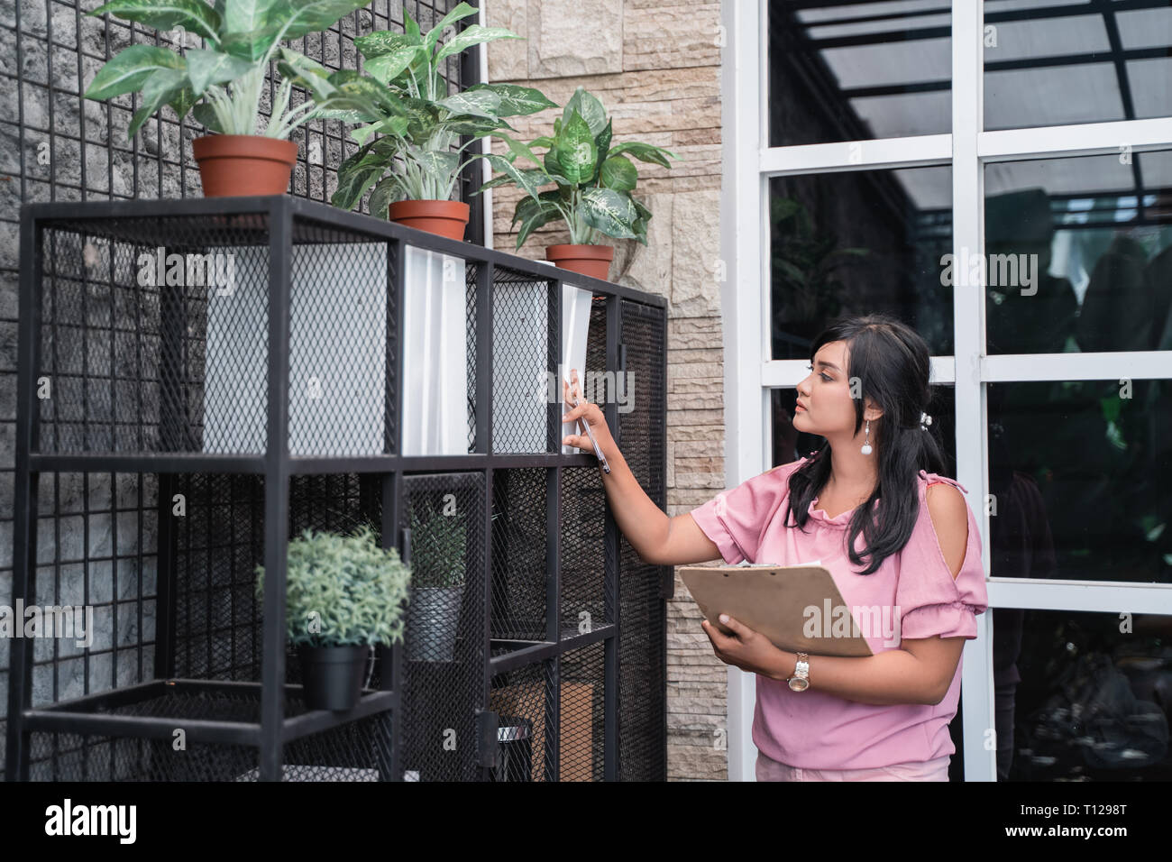 business woman checklist with clipboard in office Stock Photo - Alamy