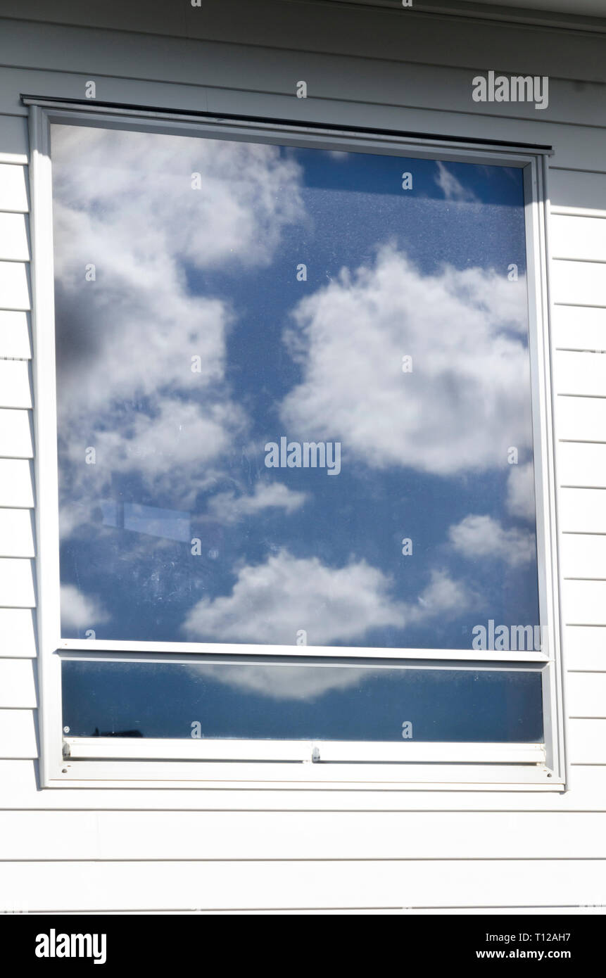 White clouds reflected in window, Wellington, North Island, New Zealand ...
