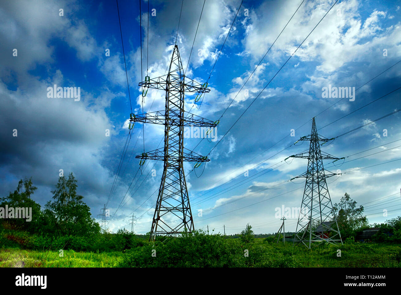 transmission tower on blue sky background Stock Photo - Alamy