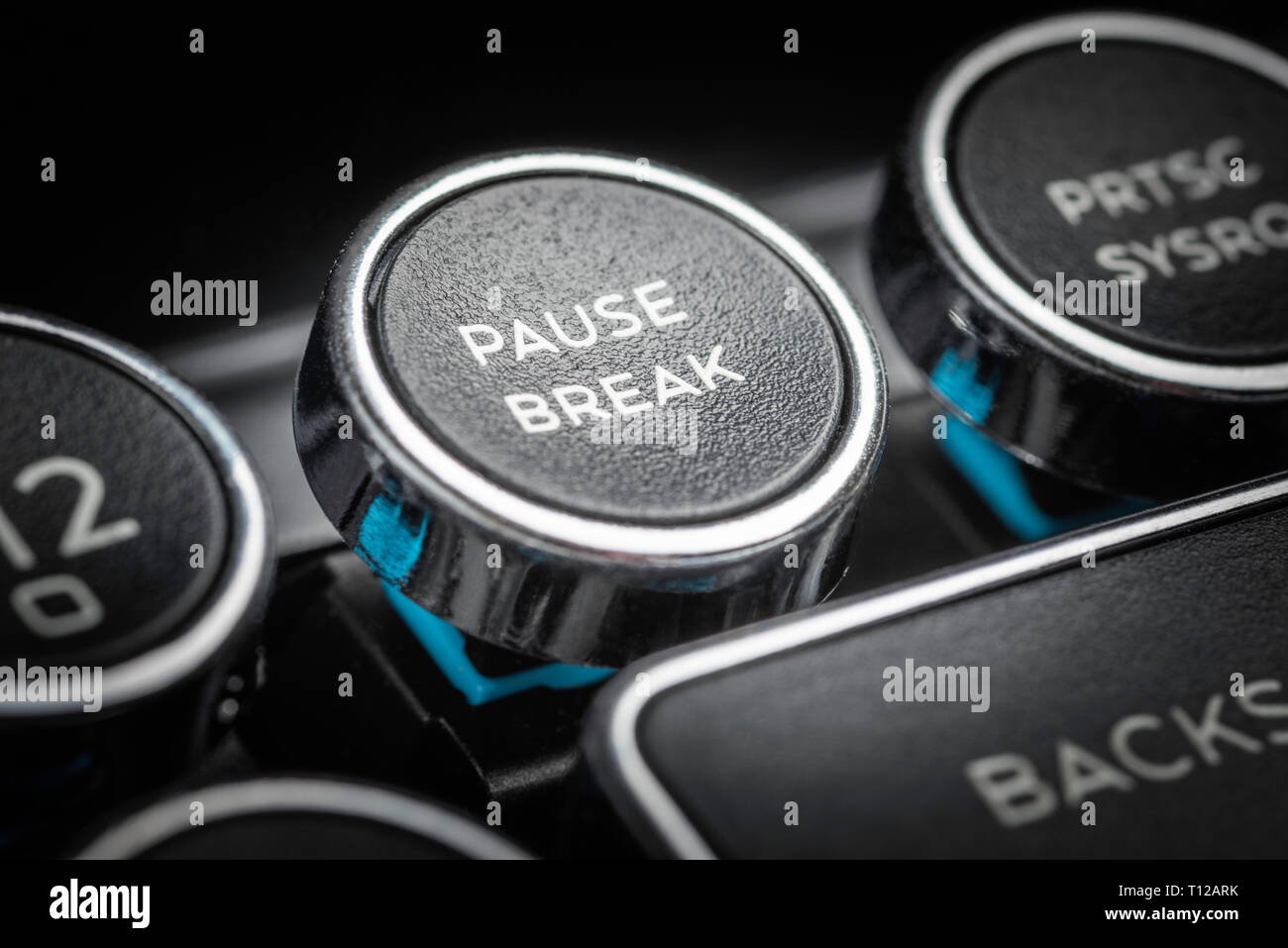 An extreme close-up or a macro shot of black circular metal keyboard ...