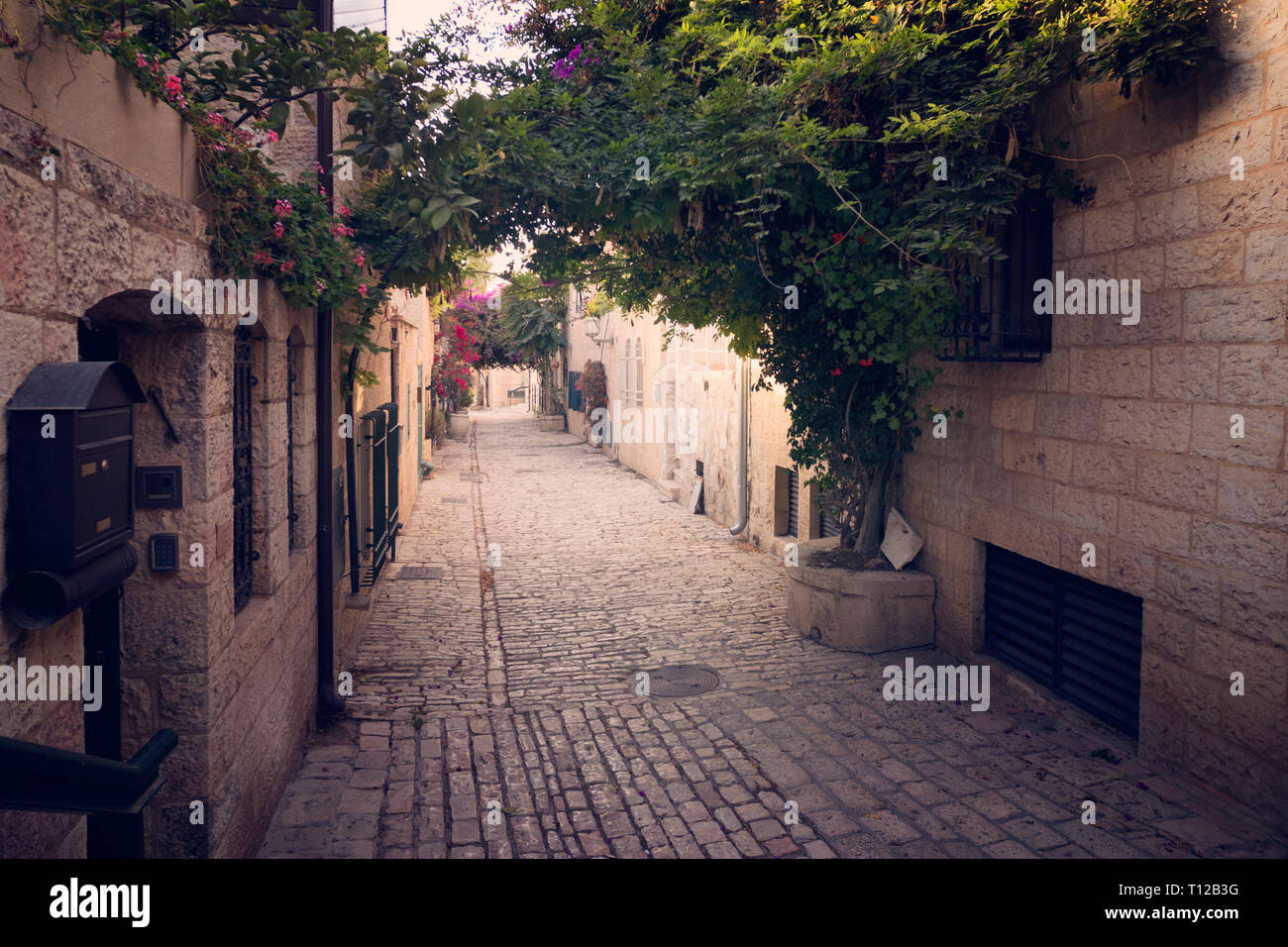 Picturesque ancient narrow alley with beautiful natural archs in some ...