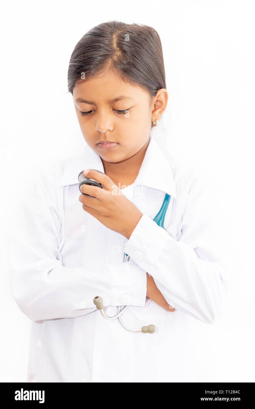 Cute little girl doctor, with stethoscope and white medical uniform ...