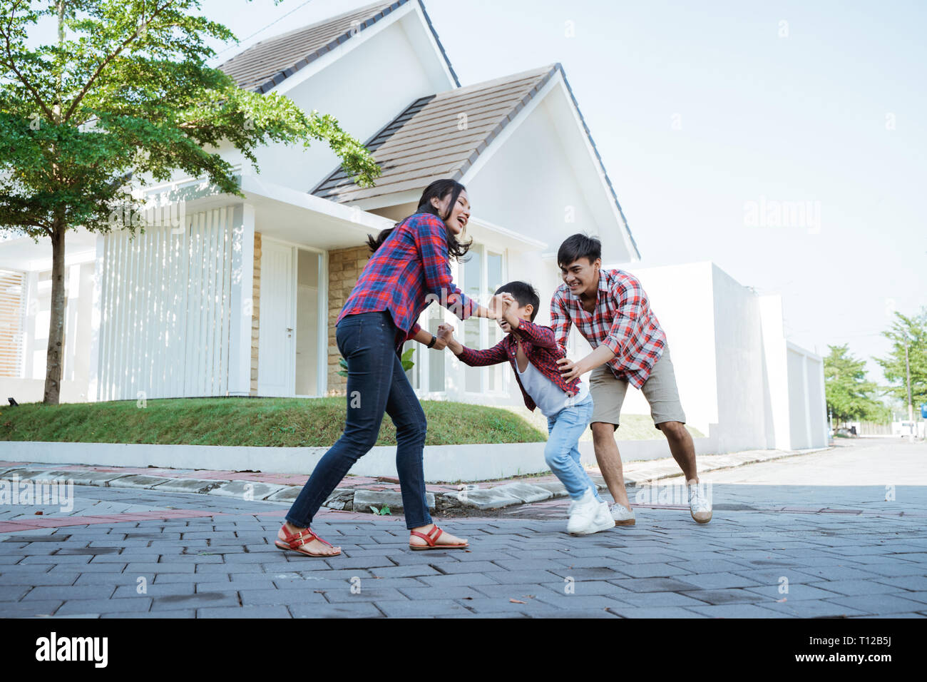 family running around together while playing and have fun Stock Photo ...