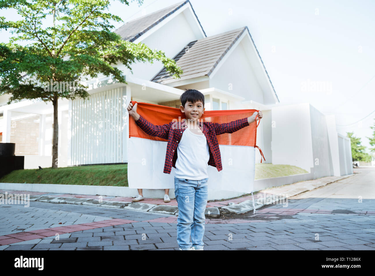 kid holding flag celebrating independence day Stock Photo - Alamy