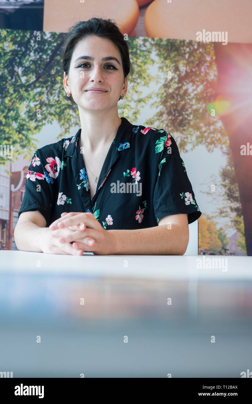 A young female student poses for a photo in an education establishment ...