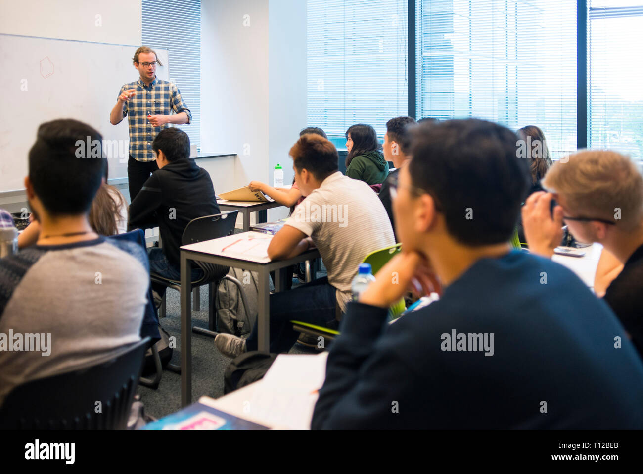 A busy classroom full of multicultural students during a lesson Stock ...