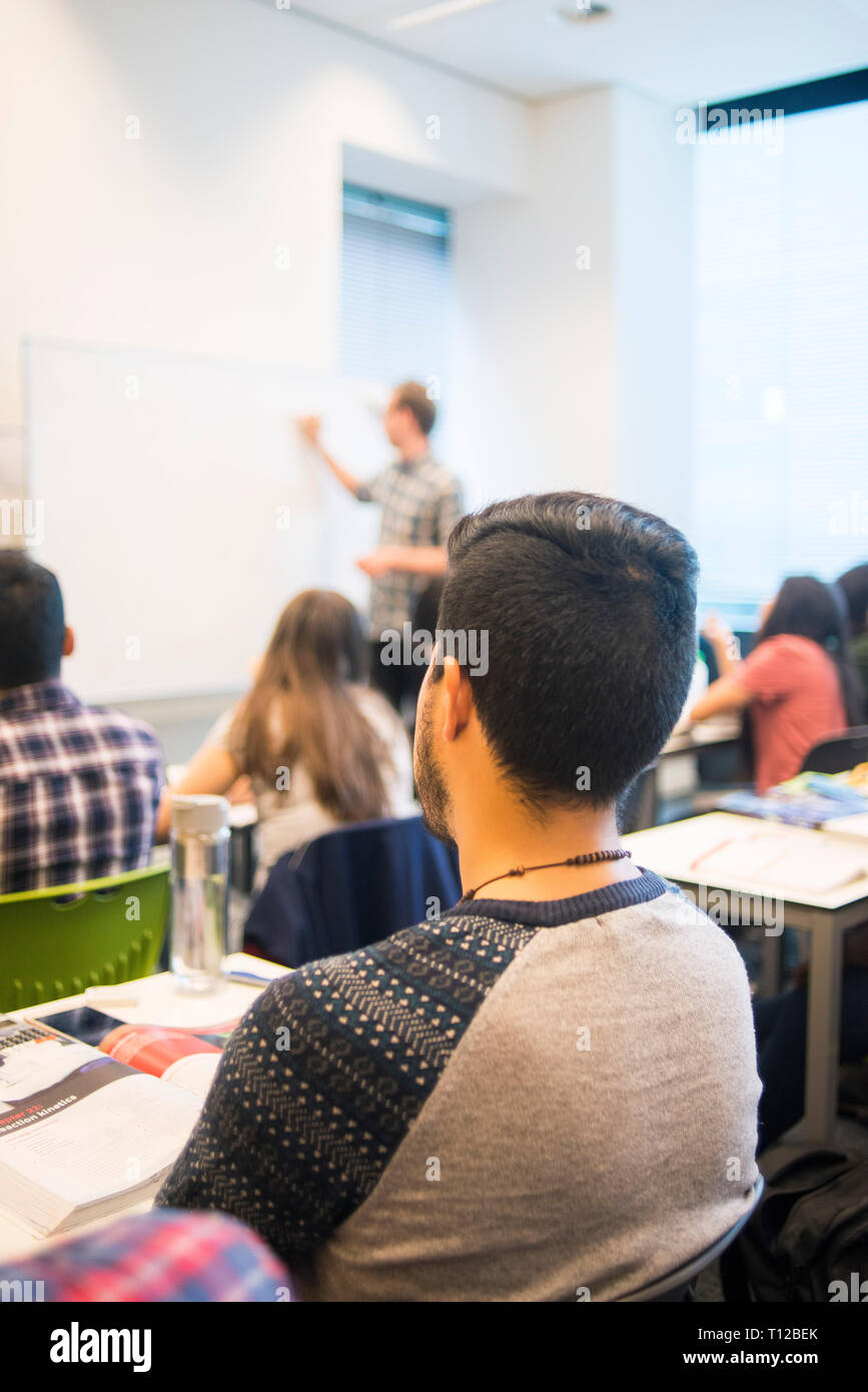 A busy classroom full of multicultural students during a lesson Stock ...