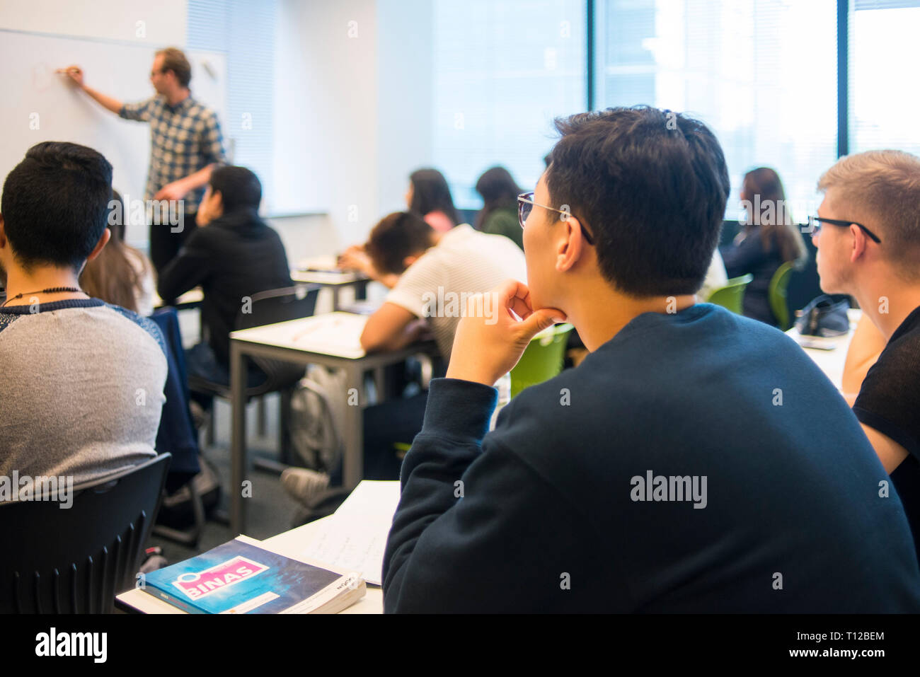 A busy classroom full of multicultural students during a lesson Stock ...