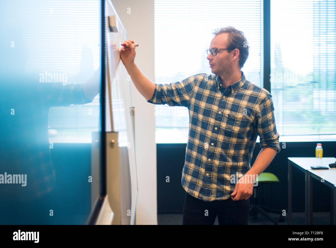 A busy classroom full of multicultural students during a lesson Stock ...
