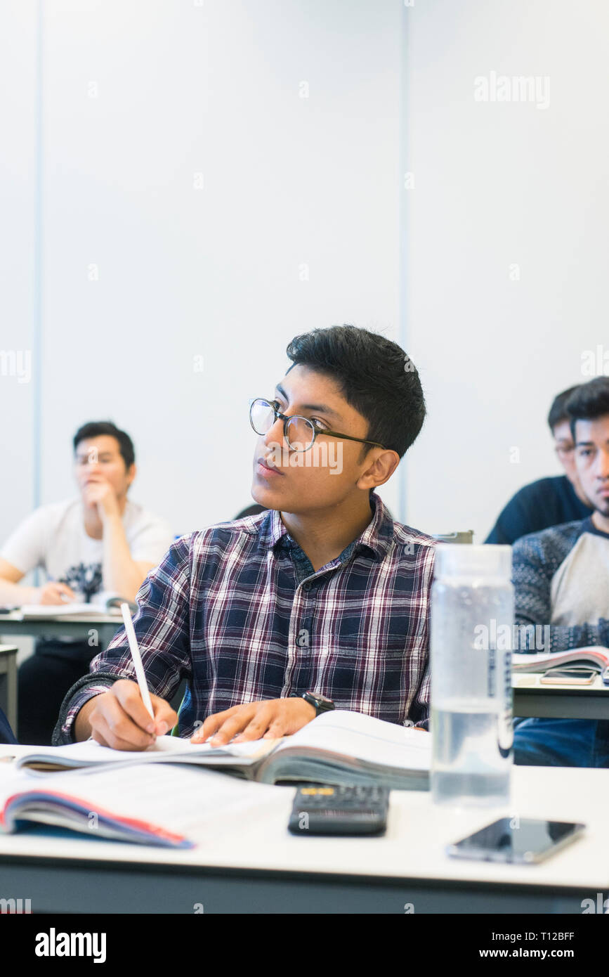 A busy classroom full of multicultural students during a lesson Stock ...