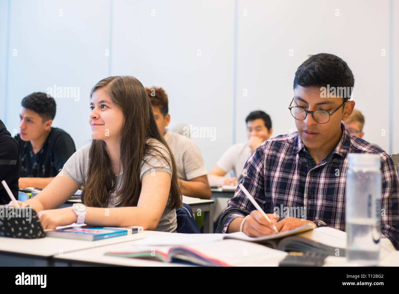 A busy classroom full of multicultural students during a lesson Stock ...